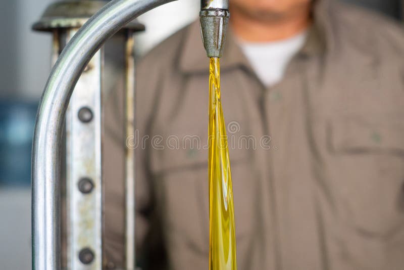 Flowing vegetable oil stock image. Image of staff, glass - 268136741