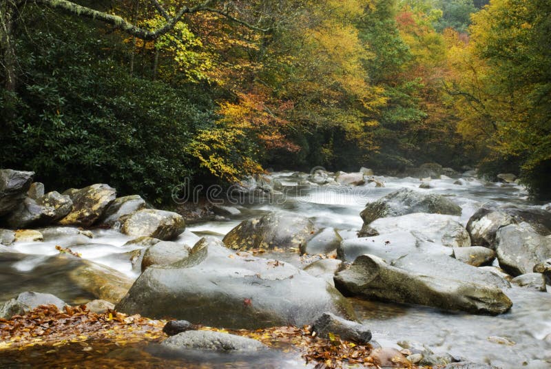 Rocky Stream with Bridge in Autumn Stock Photo - Image of rocks, water ...