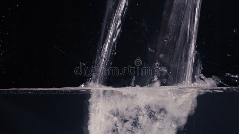 Flowing Water on Black Background Stock Image - Image of pouring ...