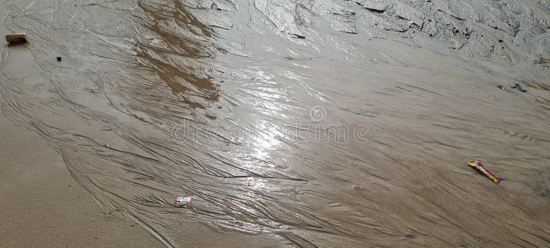 Flowing Water Mark on Beach Sand with Sunlight Reflection Stock Photo ...