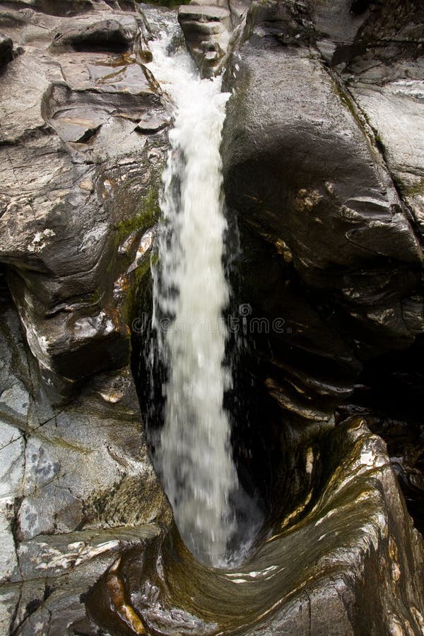 Flowing water through rock stock image. Image of shapes - 6027657
