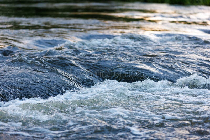 Flowing Water of a Summer River with a Small Rapid Waterfall at Evening ...
