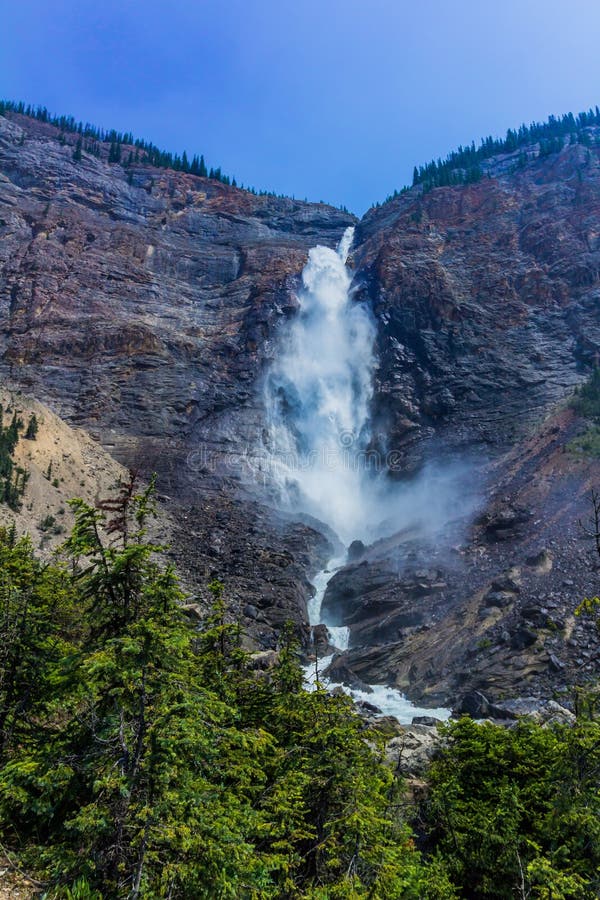 Flowing Waterfall from Rocks Surrounded by Trees Stock Image - Image of ...