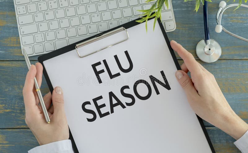 FLU SEASON Text Written in a Notebook Lying on a Desk and a Stethoscope ...