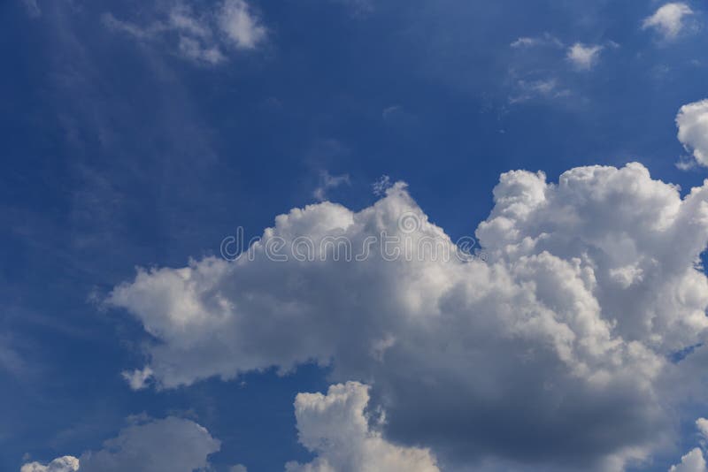 Fluffy Beautiful Clouds on a Background of Blue Sky Stock Image - Image ...