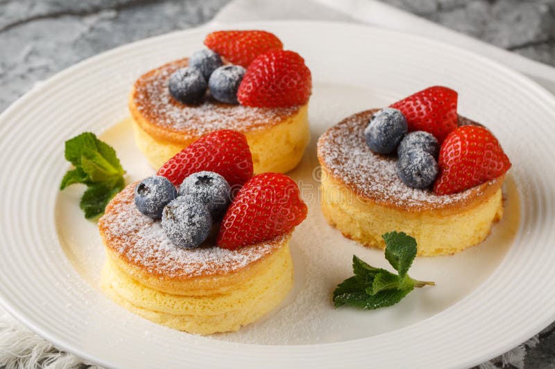 Fluffy and Delicious Souffle Pancakes with Powdered Sugar Close-up on a ...