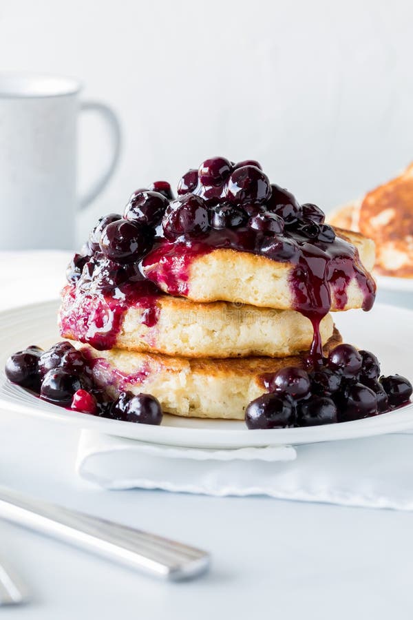 Fluffy Pancake Stack Topped with Warm Blueberry Sauce Ready for Eating ...
