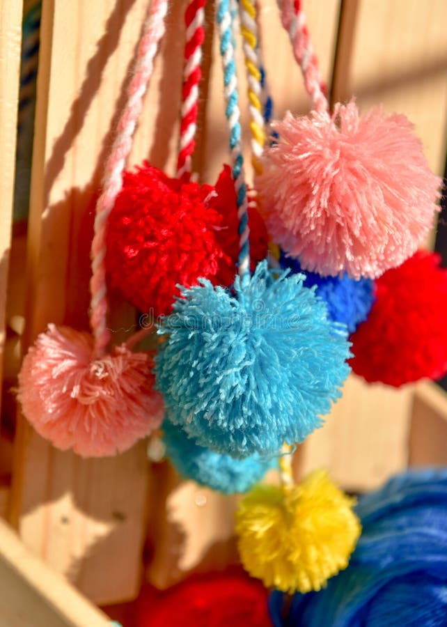 Fluffy Pom Poms with Multi-colored Threads. Stock Photo - Image of ...