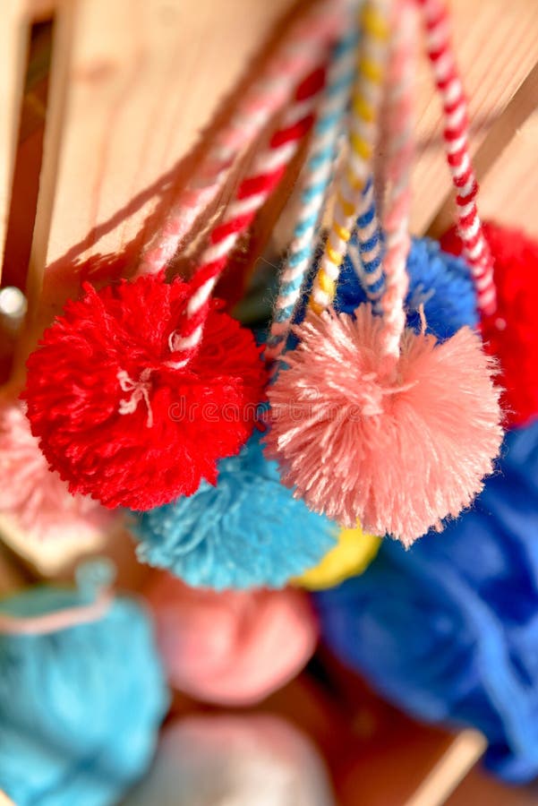 Fluffy Pom Poms with Multi-colored Threads. Stock Photo - Image of ...