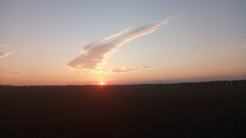 Fluffy White Cloud in the Setting Sun Shaped Like a Rabbit Jumping Over ...