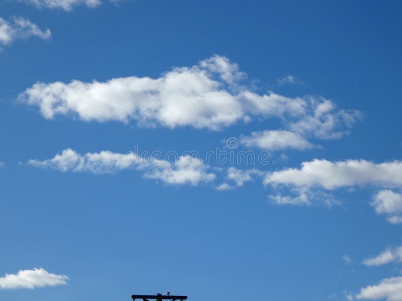 Fluffy White Clouds in a Deep Blue Sky Stock Image - Image of cloud ...