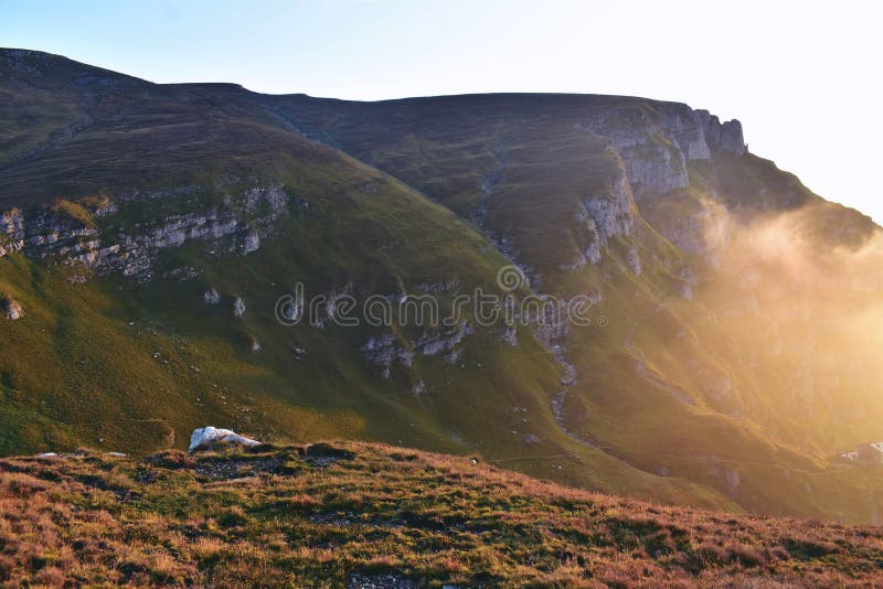 Fluffy White Clouds among the Mountain Ridges. Mist at High Altitude ...
