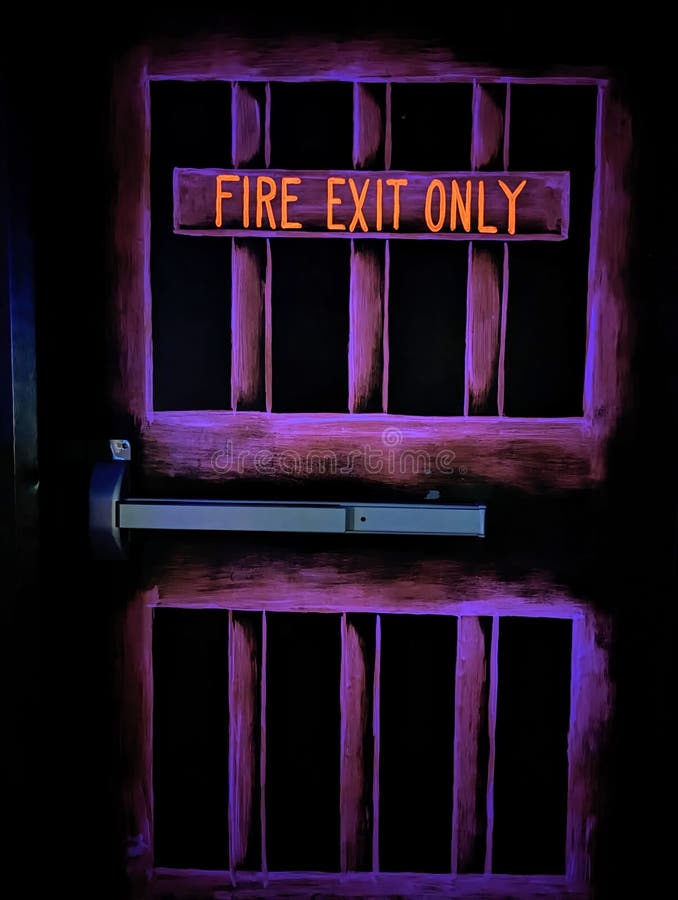 Fluorescent Glowing Fire Exit only Door Sign Stock Photo - Image of ...