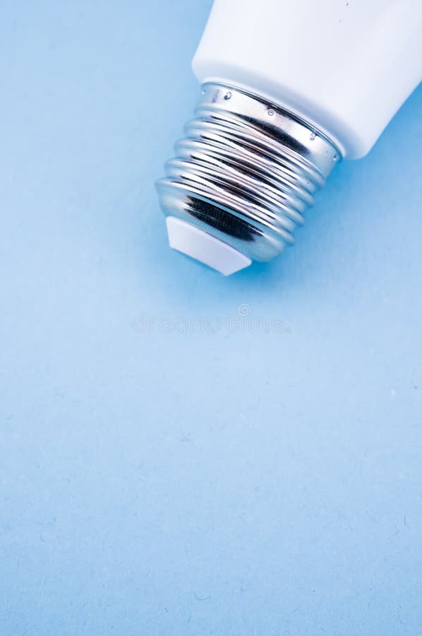 Fluorescent Light Bulb on the Blue Surface Stock Image - Image of ...