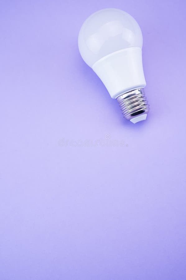 Fluorescent Light Bulb on the Purple Surface Stock Photo - Image of ...