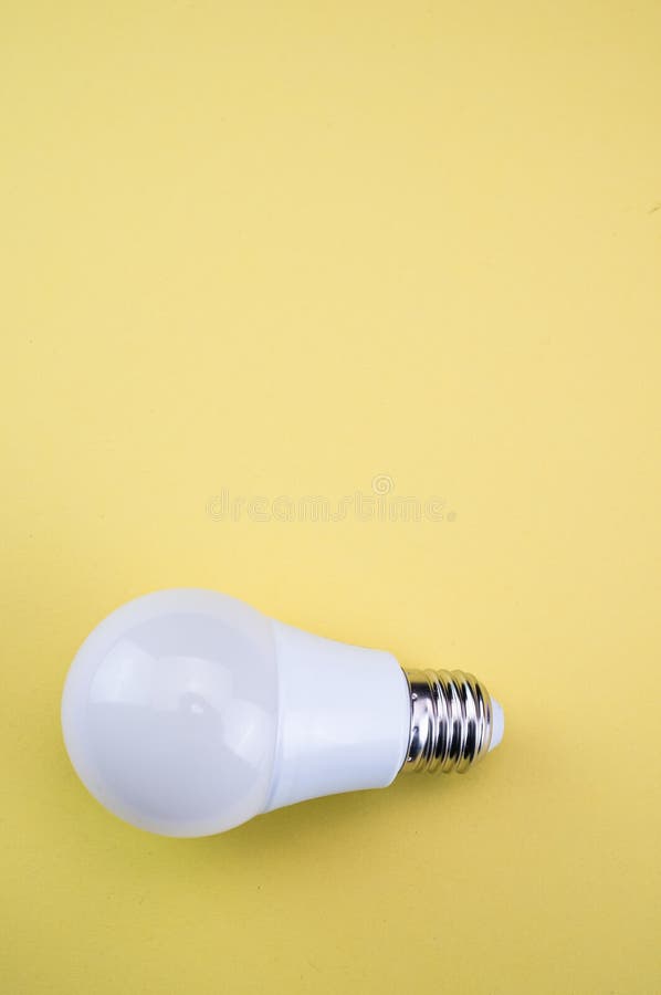 Fluorescent Light Bulb on the Yellow Surface Stock Image - Image of ...