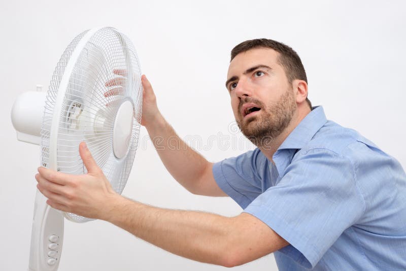 Flushed Man Feeling Hot in Front of a Fan Stock Photo - Image of ...