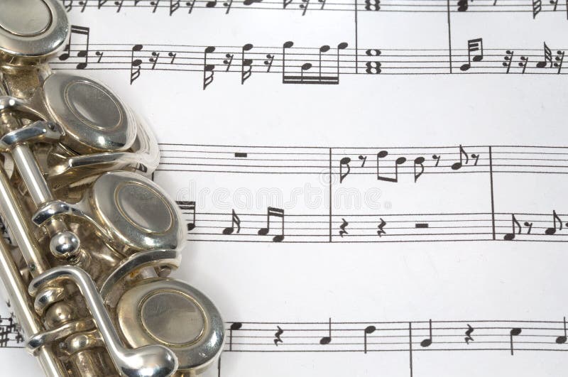 A flute on sheet music stock photo. Image of flautist - 2373594