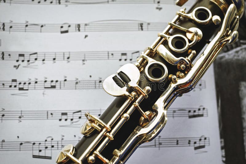 A Flute with Musical Notes on a Page of Sheet Music in the Background ...