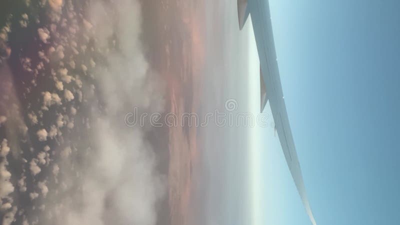 Fly Above the Clouds, Vertical View from Inside an Airplane with Clouds ...