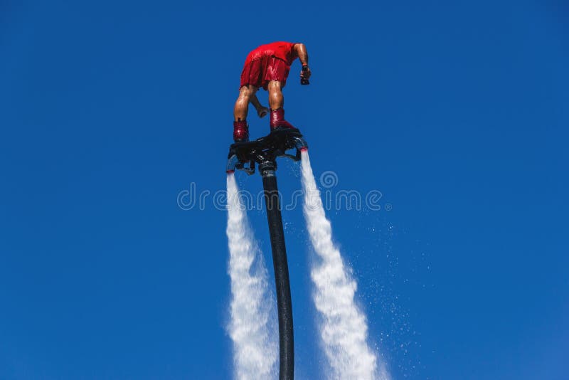 Fly Board, Man on a Flyboard in Red Stock Image - Image of extreme ...