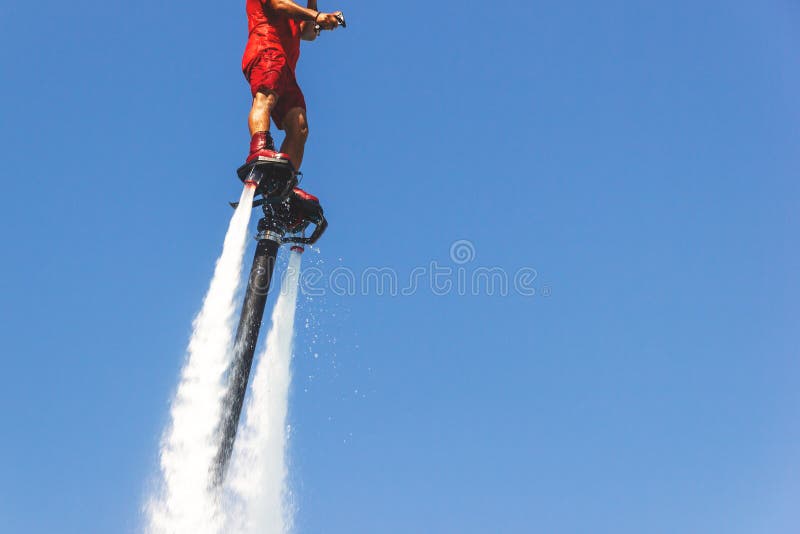 Fly Board, Man on a Flyboard in Red Editorial Image - Image of outdoor ...