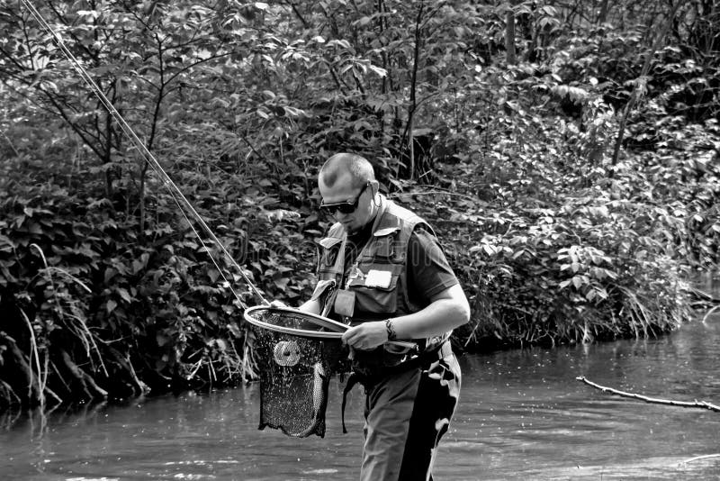 Fly fisherman or angler stock image. Image of black, fishing - 3777483