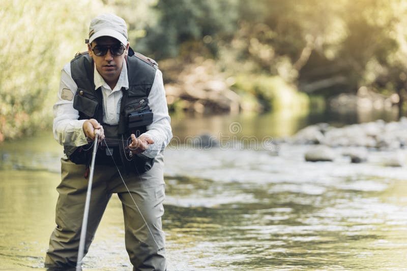Fly Fisherman Using Flyfishing Rod. Stock Image - Image of mountain ...