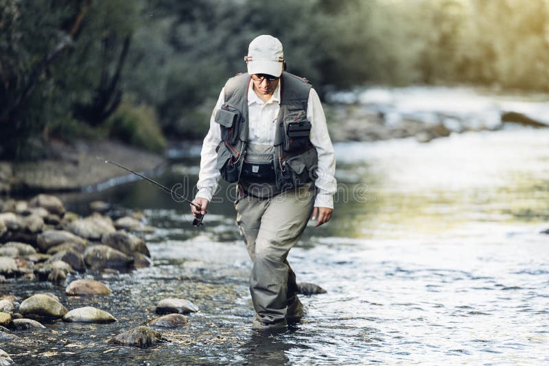Fly Fisherman Using Flyfishing Rod. Stock Image - Image of trout, tree ...