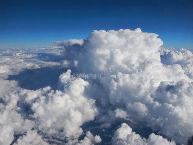 Flying above the clouds stock photo. Image of plain - 146607660