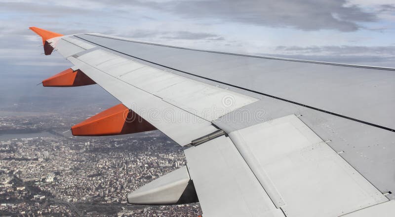 Airplane Left Wing with Clouds and Blue Sky Background. Stock Image ...