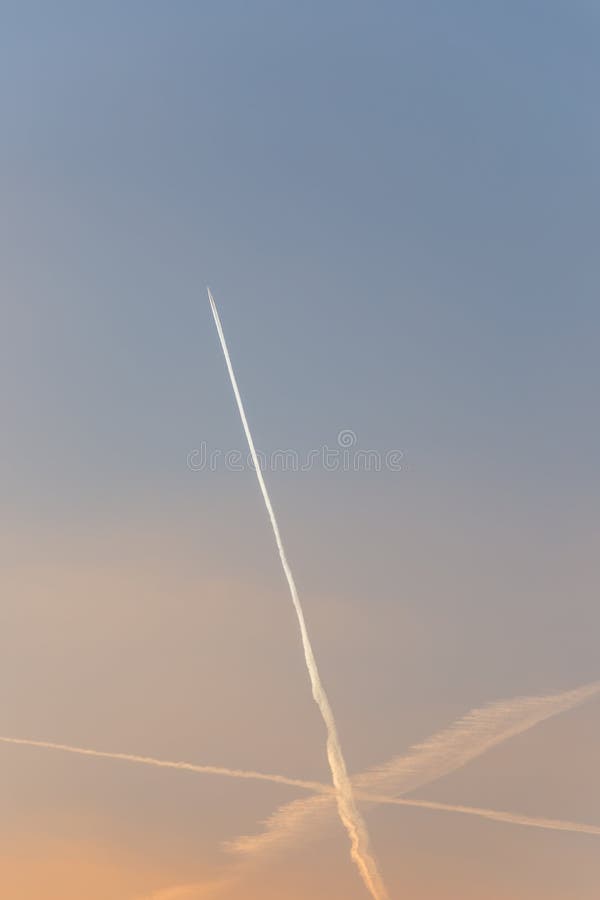 Flying Airplane Trail in a Clear Sky Stock Photo - Image of blue, pass ...