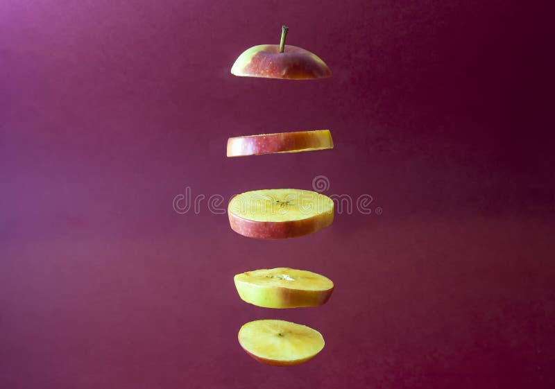 Flying Apple Slices with Red Background Stock Photo - Image of ...