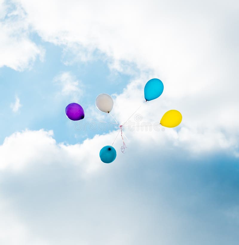 Flying with balloons stock image. Image of field, cloudy - 19709639