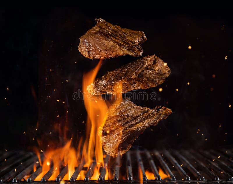 Flying Beef Steaks Above Burning Grill Grid Stock Image - Image of ...