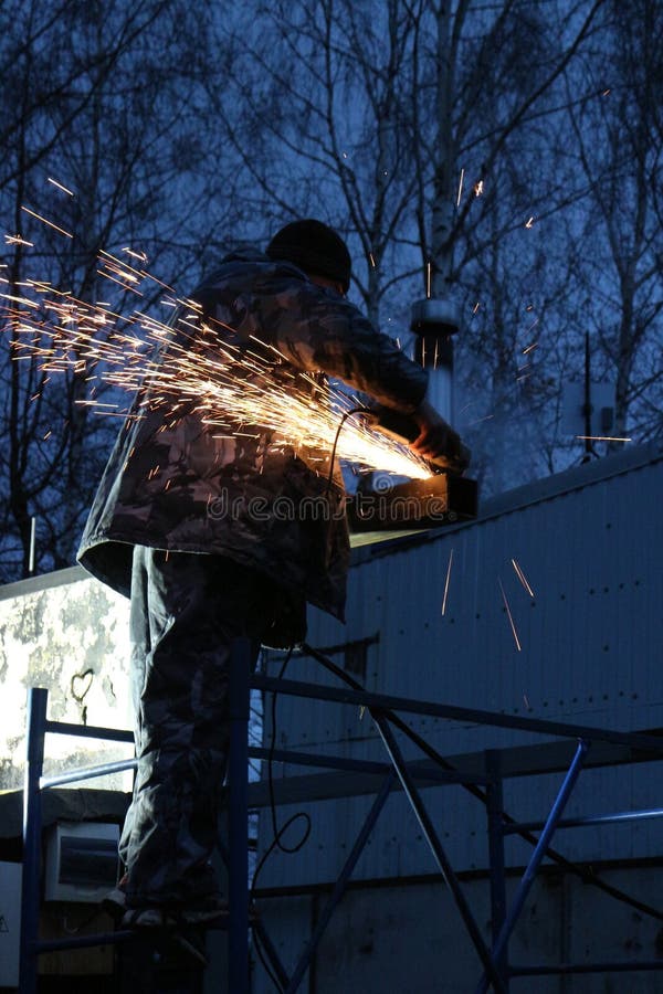 Flying Bright Sparks from Under the Cutting Machine Stock Image - Image ...