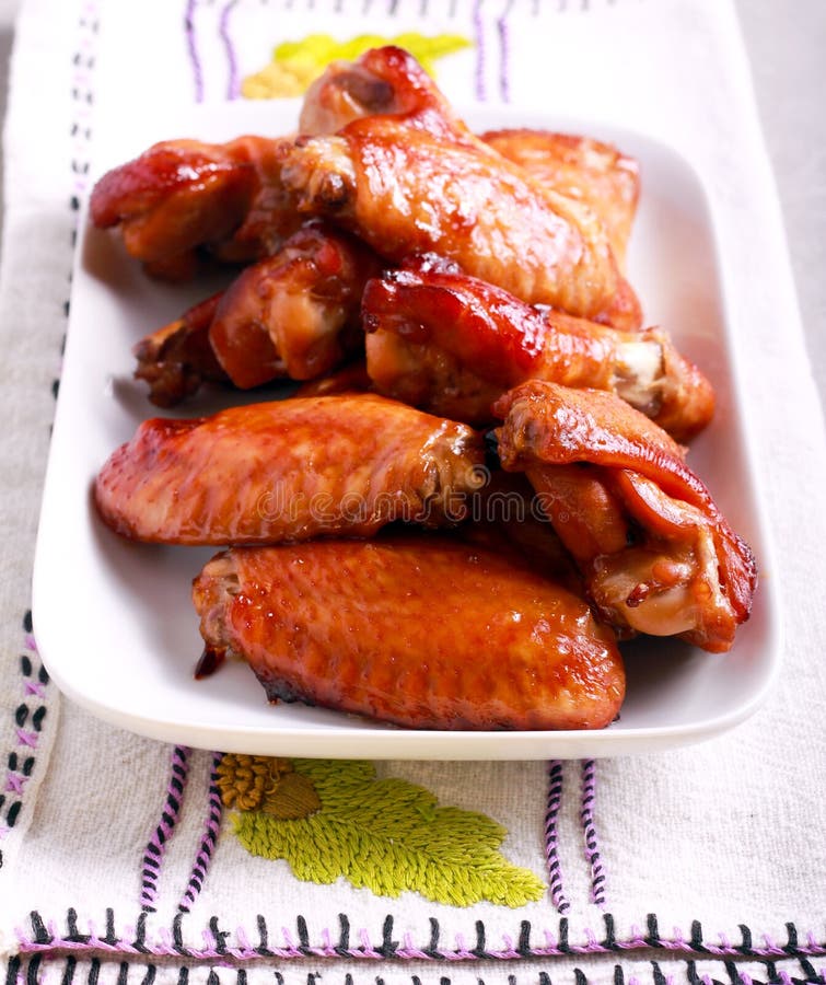 Flying Chicken Wings on Plate Stock Photo - Image of wings, glazed ...