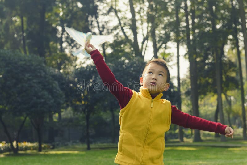 Kid flying toy bird stock image. Image of childhood, play - 84592151