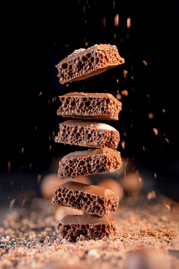 Flying Chocolate Pieces on Black Backdrop. Stock Image - Image of chunk ...