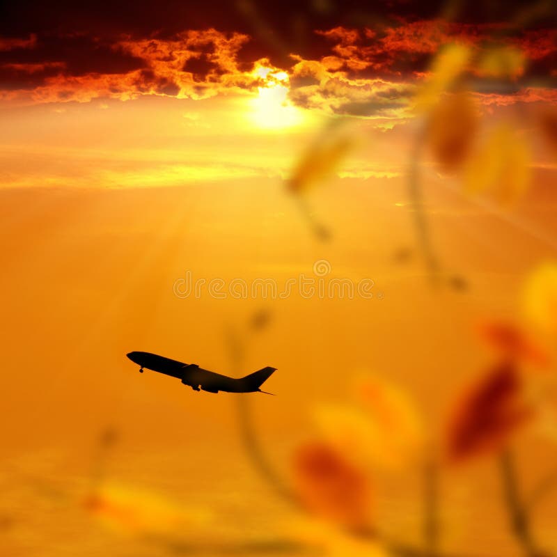 Airplane flying at sunset stock photo. Image of corporate - 23804176
