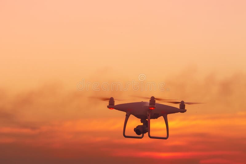 Flying Drone on the Background of a Beautiful Sunset Stock Photo ...