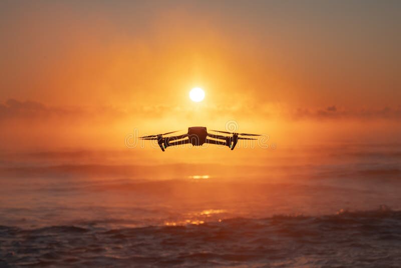 Flying Drone Over Ocean Horizon during Vibrant Sunset Stock Image ...