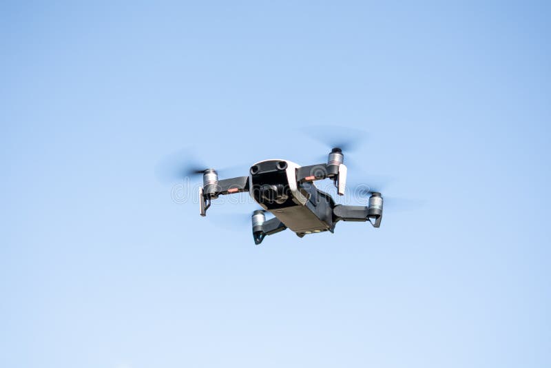 Flying Drone with Recording Camera with Blue Sky Behind Stock Image ...