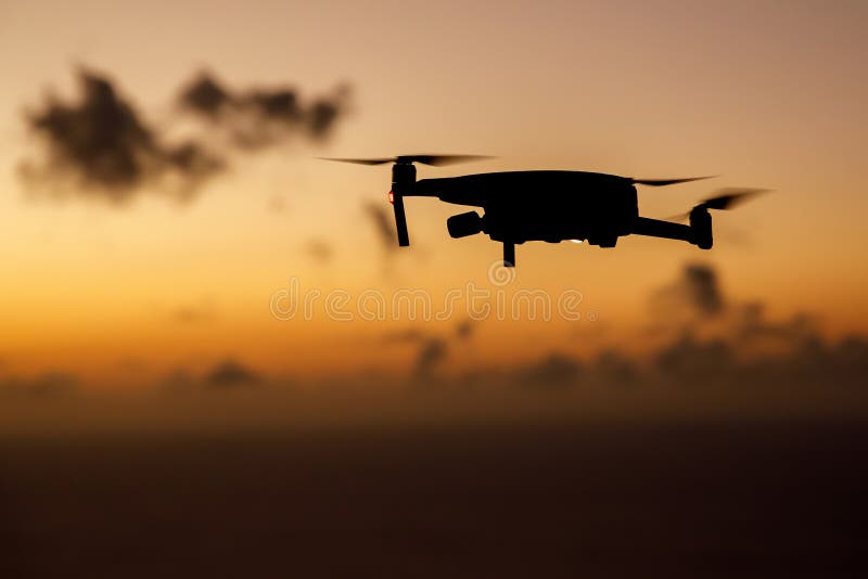 Flying Drone in a Sunset Sky. Stock Photo - Image of sunset, pilot ...