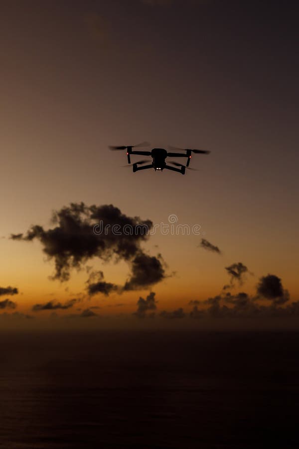 Flying Drone in a Sunset Sky. Stock Image - Image of digital, video ...