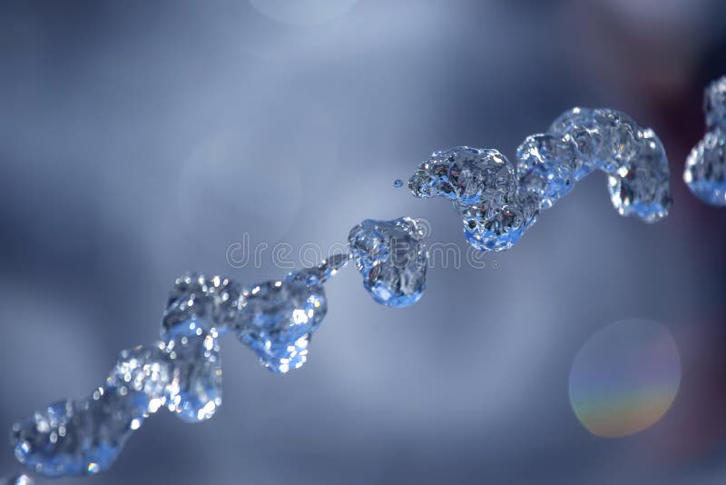 Flying Drops of Water Fountain Close Up Stock Photo - Image of light ...