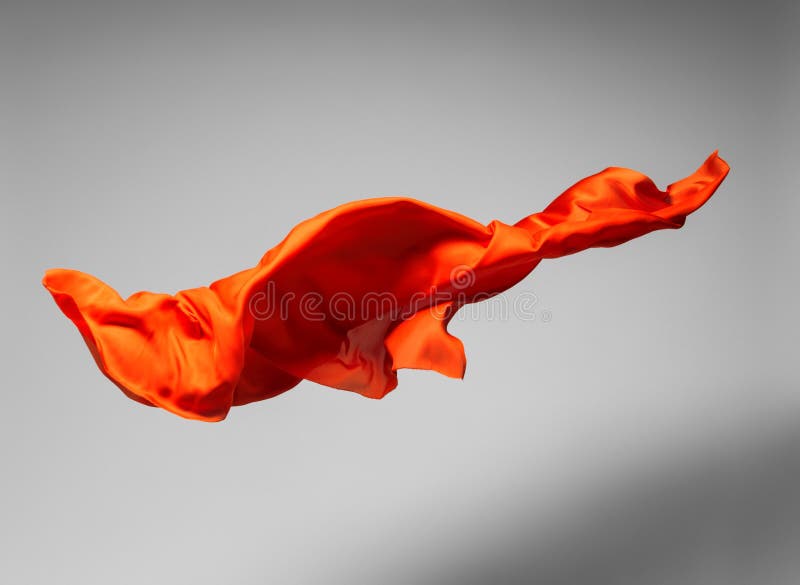 Orange flying fabric stock image. Image of golden, action - 100306163