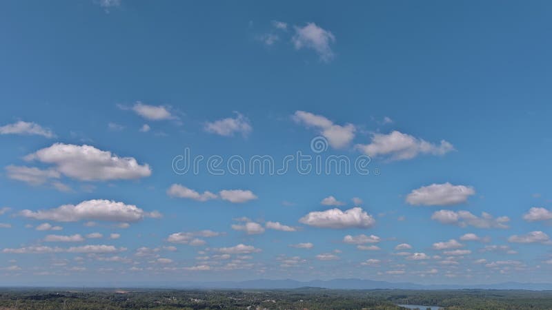 Flying through Fluffy Clouds Moving in Blue Sky Surrounded by a ...