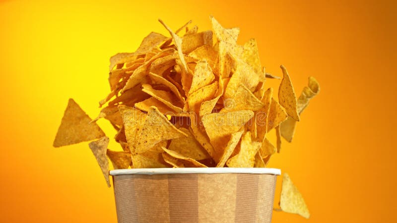 Flying Fried Tortilla Chips Exploding from Paper Bucket. Stock Photo ...