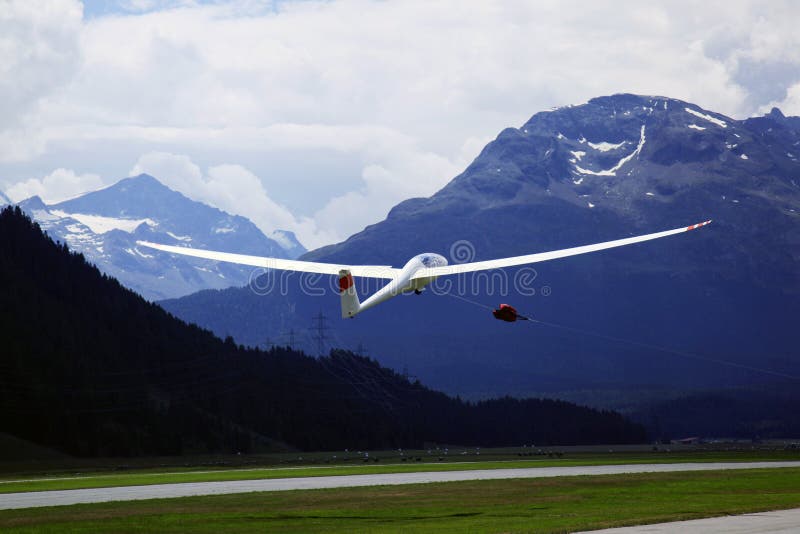 A Flying Glider in the Alps Stock Image - Image of intheair, sport ...